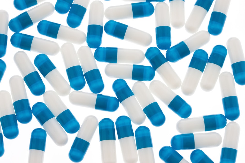 Cápsulas azules y blancas